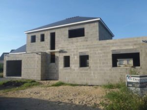 Brique, ossature bois ou parpaing : quel matériau choisir pour la ...